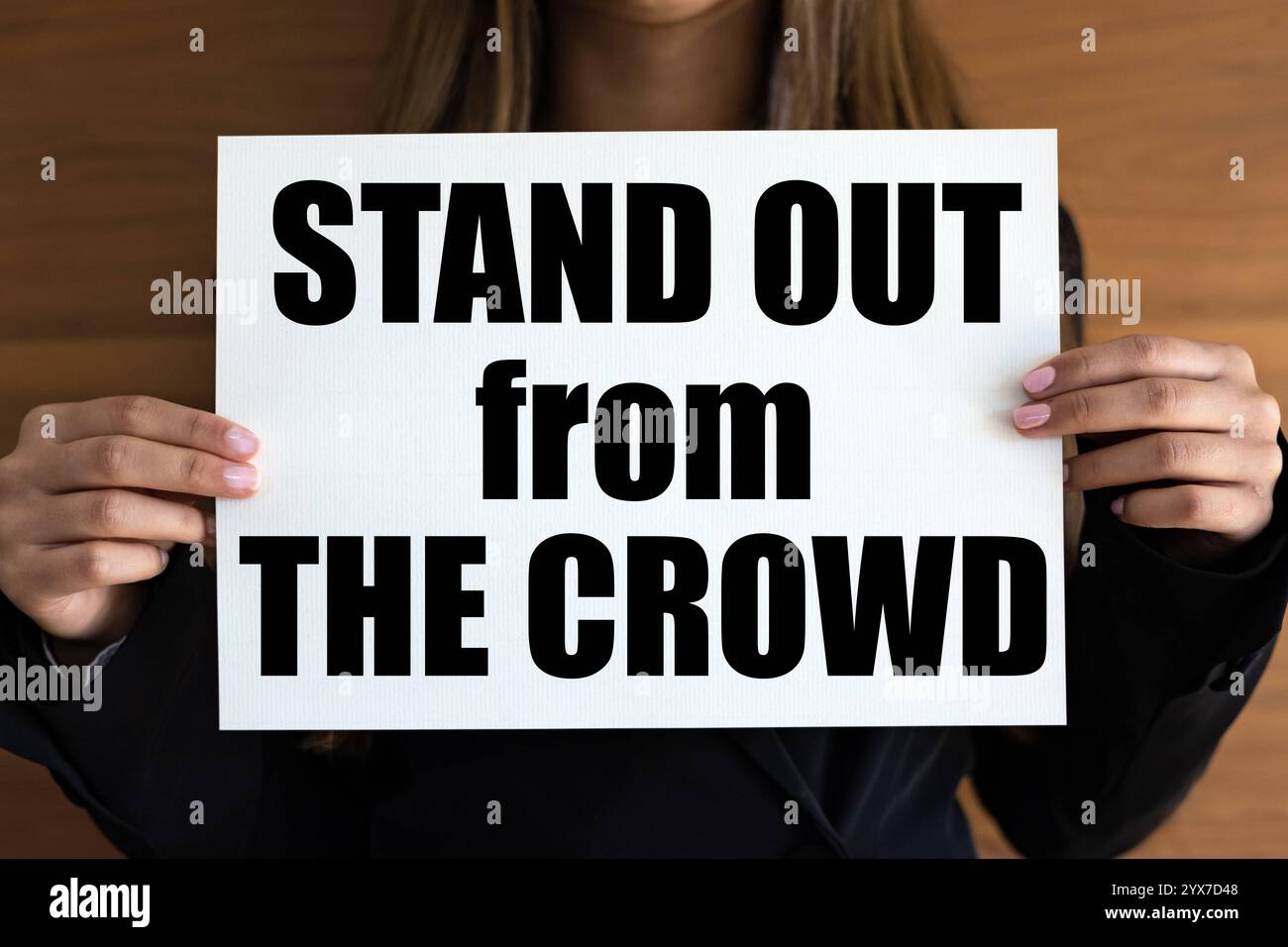 Stand out from the crowd. Stand out from the crowd. Woman with white ...