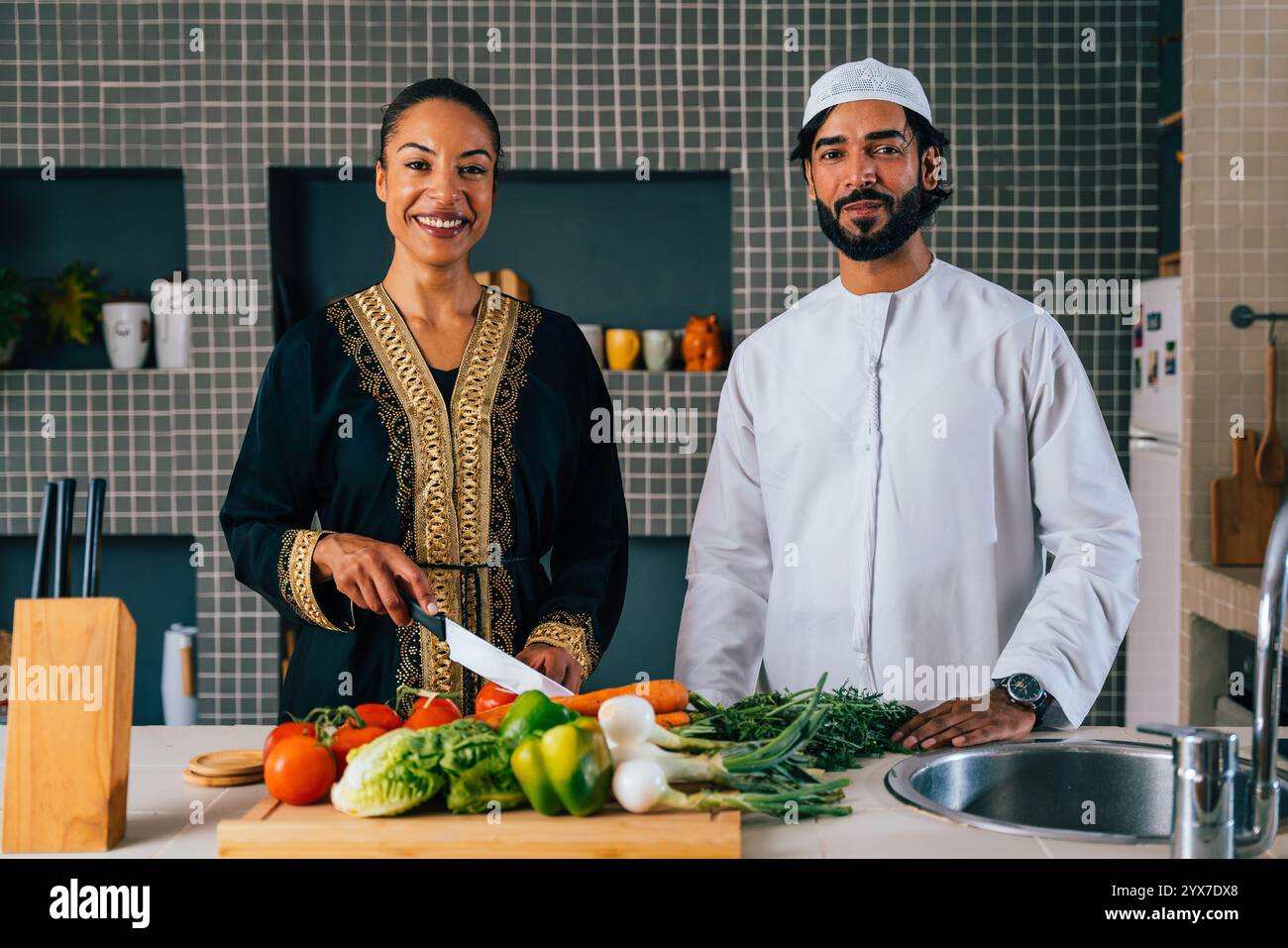 Happy beautiful young arab couple with emirati clothing together at ...