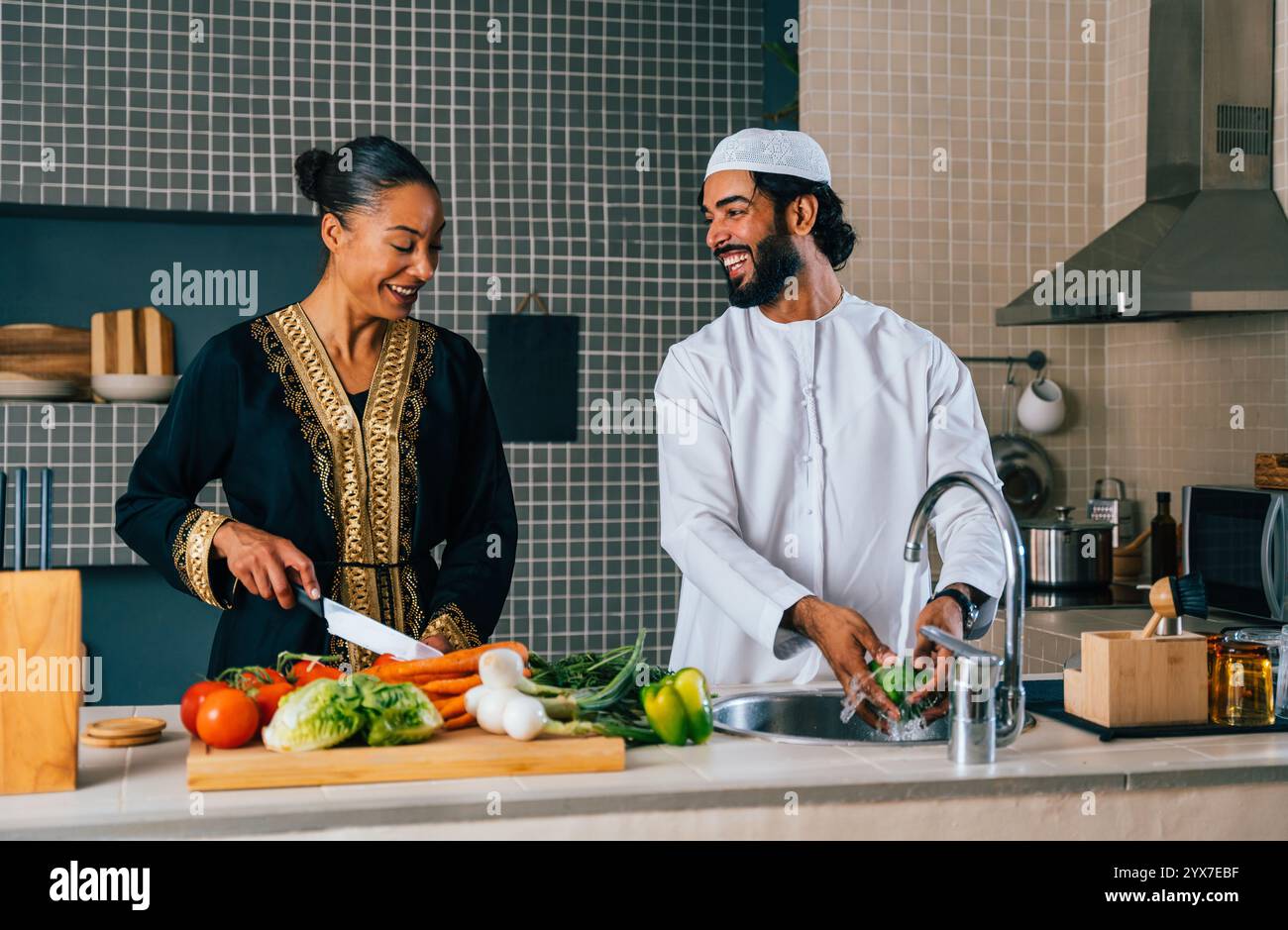 Happy beautiful young arab couple with emirati clothing together at ...