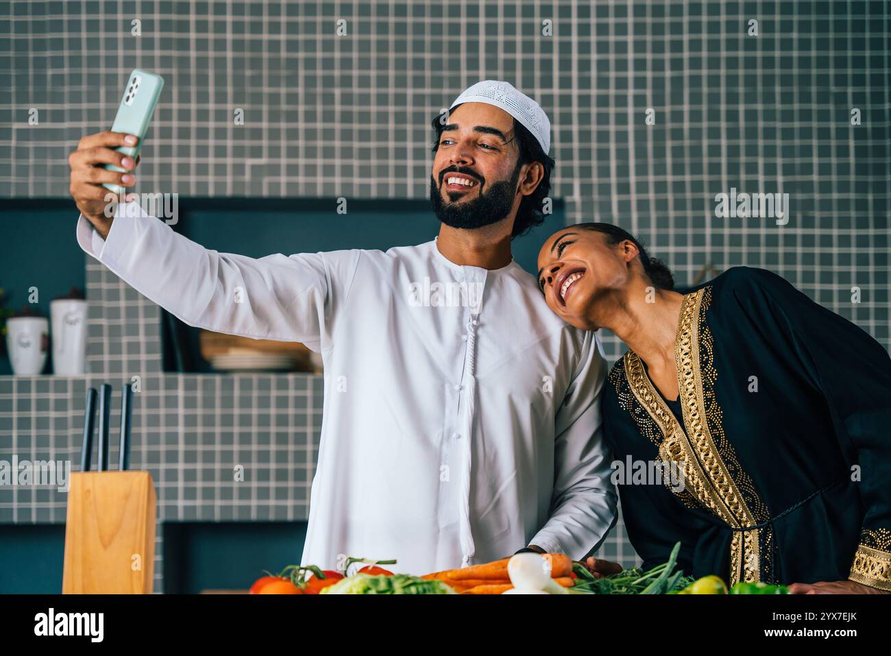 Happy beautiful young arab couple with emirati clothing together at ...