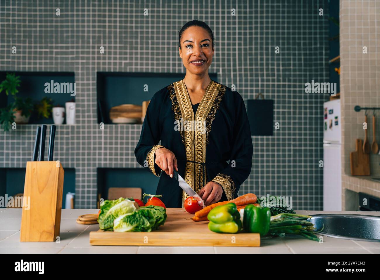Happy beautiful young arab woman wearing traditional emirati abaya ...
