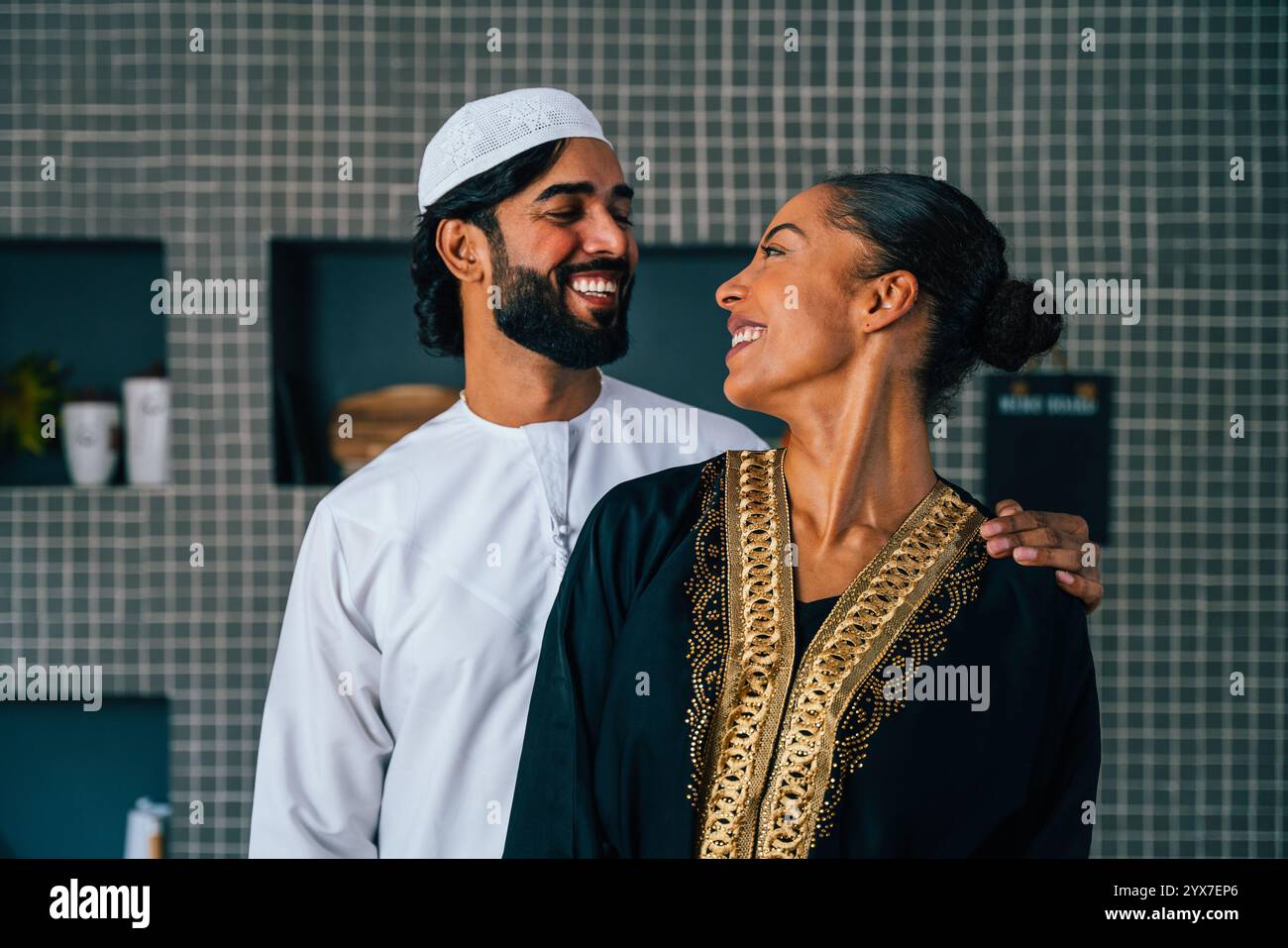 Happy beautiful young arab couple with emirati clothing together at ...