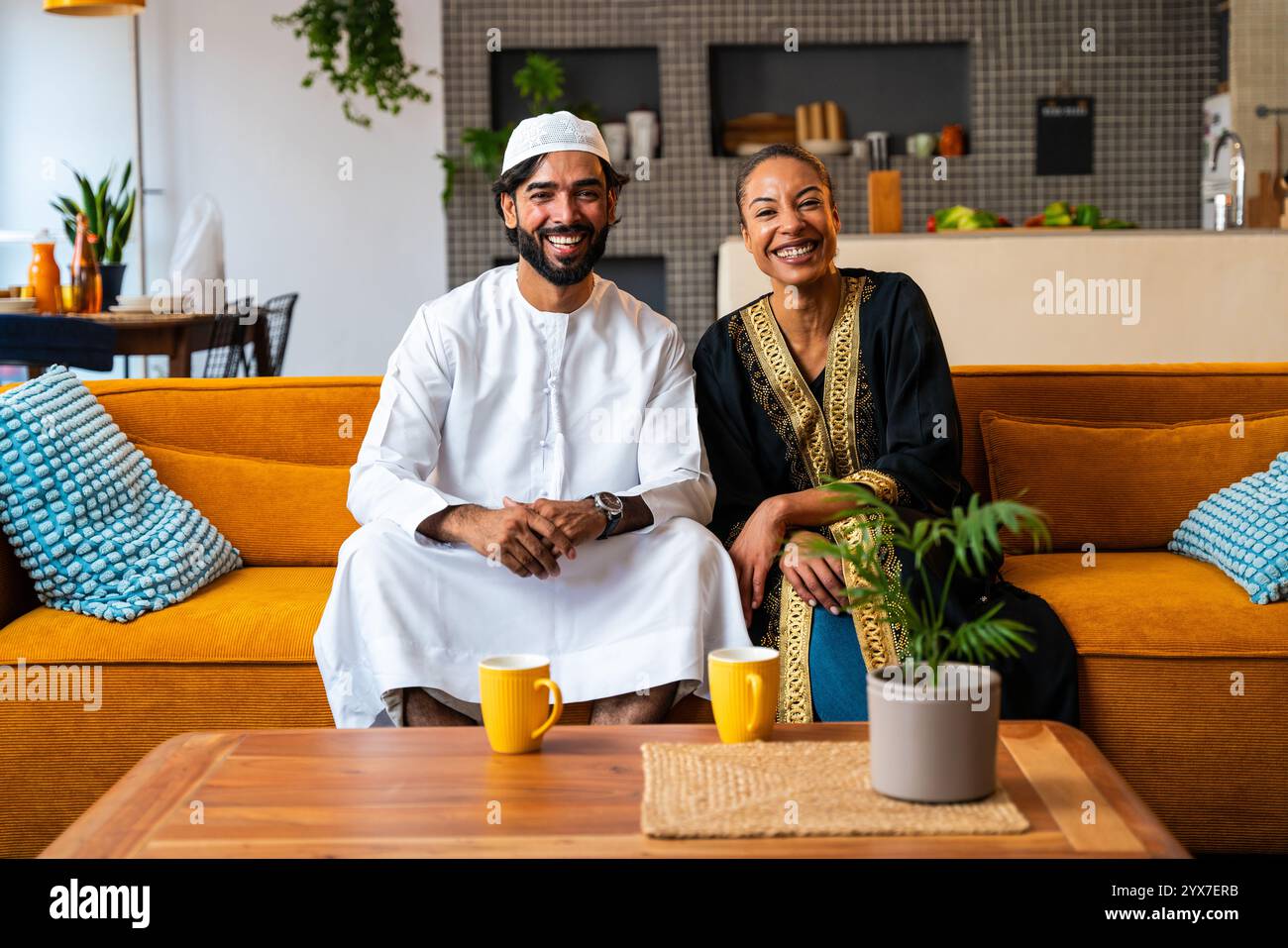 Happy beautiful young arab couple with emirati clothing together at ...