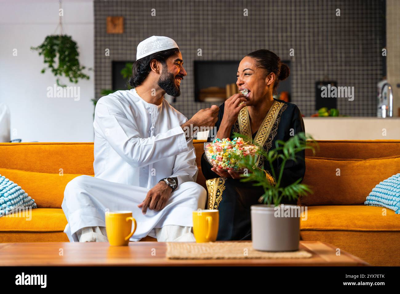 Happy beautiful young arab couple with emirati clothing together at ...