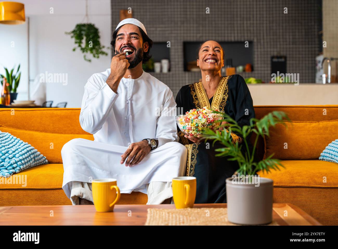 Happy beautiful young arab couple with emirati clothing together at ...