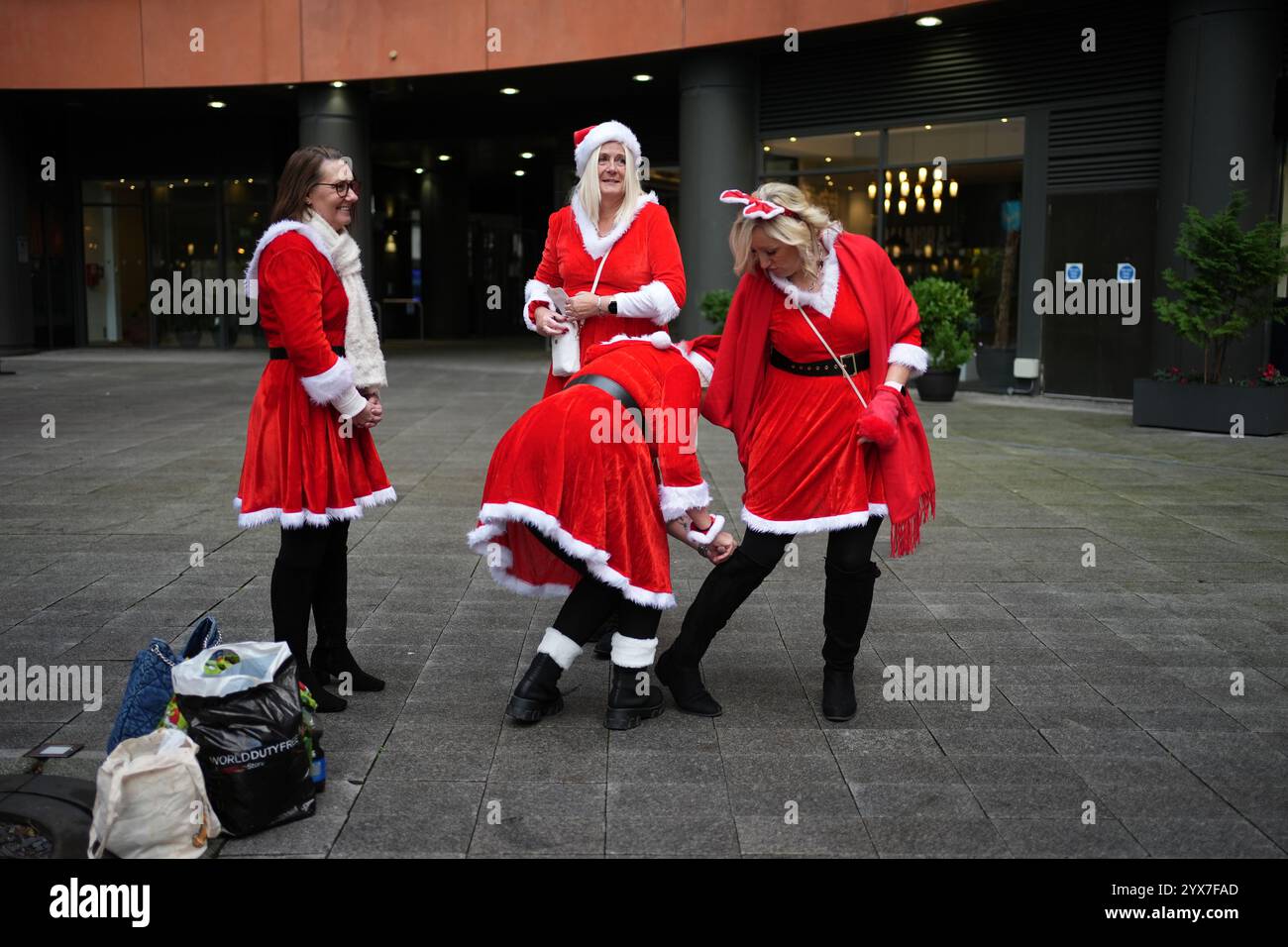 People dressed as Santa ahead of taking part in the London Santacon ...