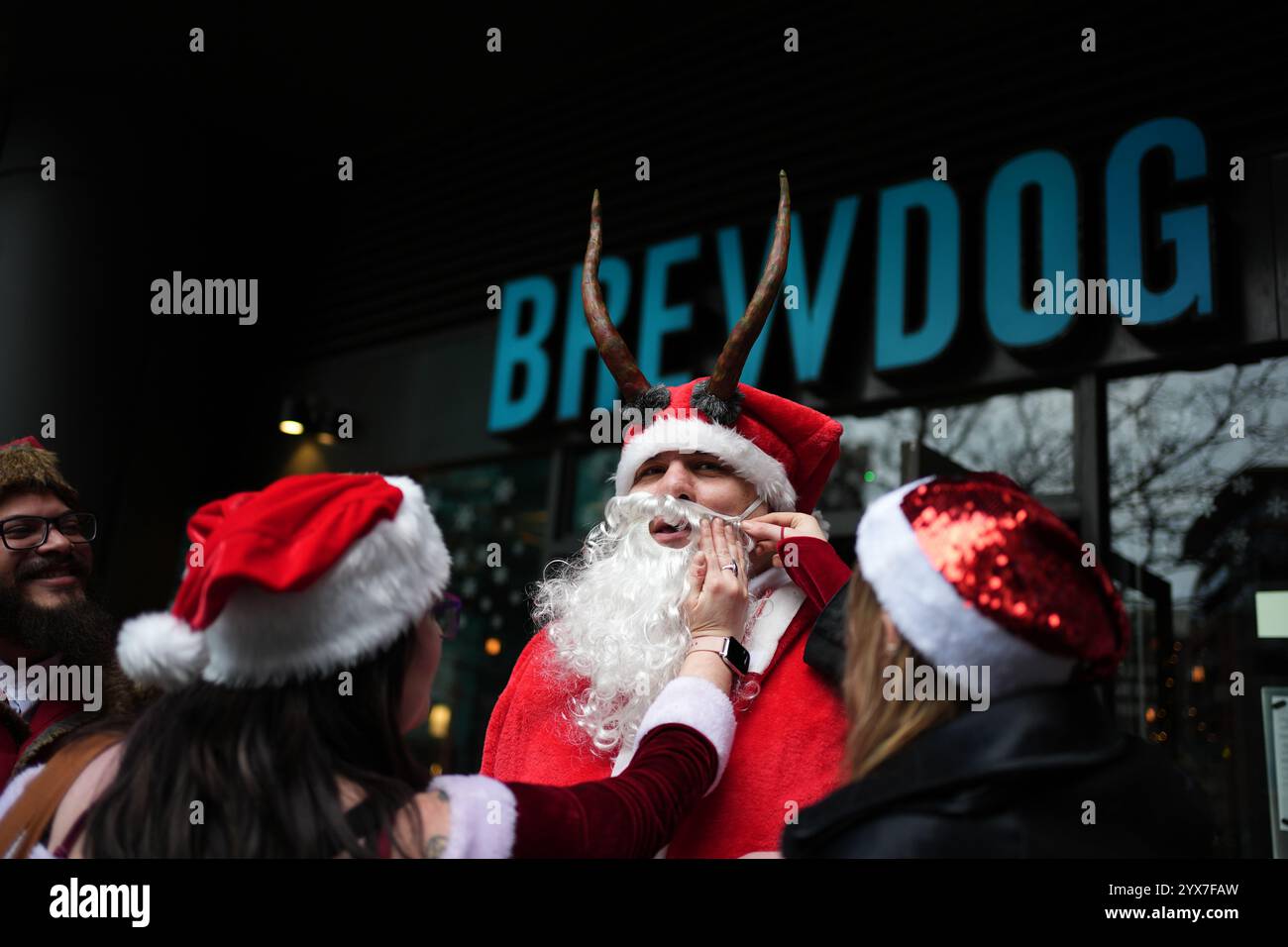People dressed as Santa ahead of taking part in the London Santacon ...