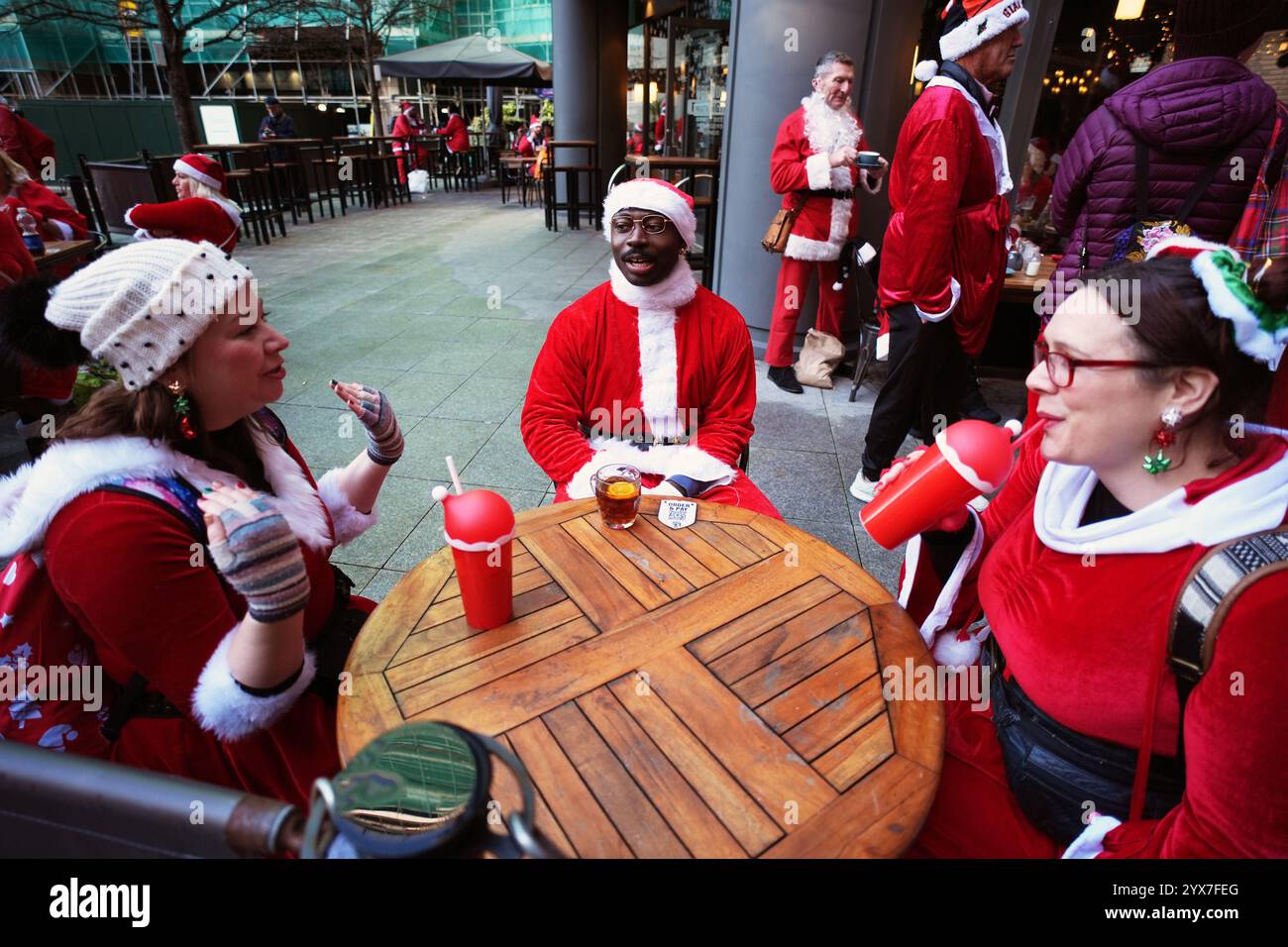 People dressed as Santa ahead of taking part in the London Santacon ...