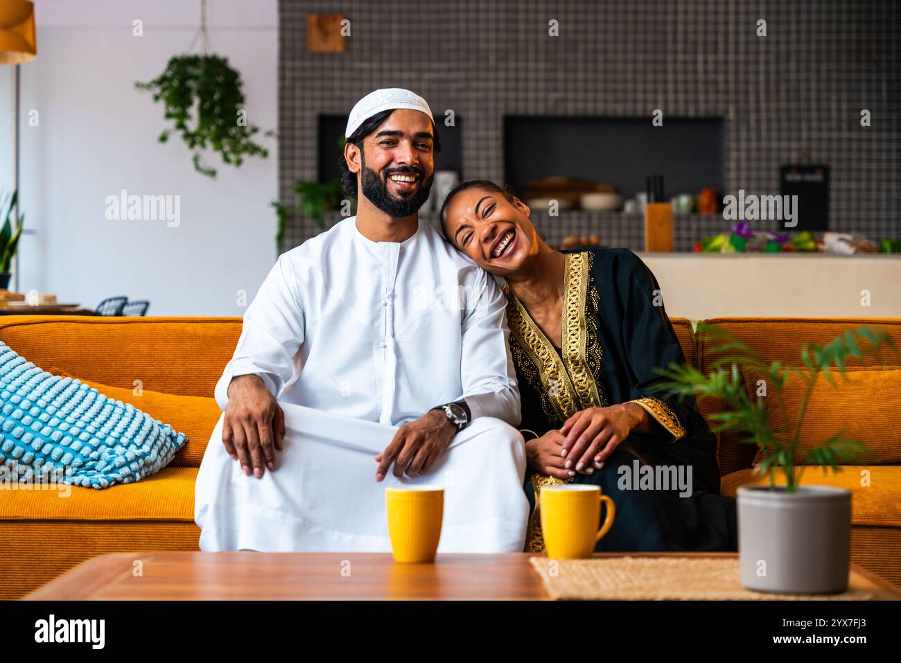 Happy beautiful young arab couple with emirati clothing together at ...
