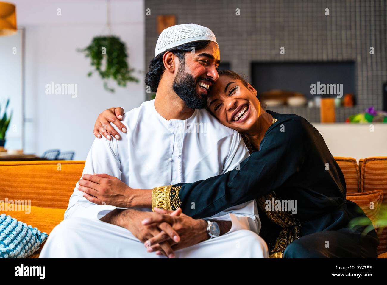Happy beautiful young arab couple with emirati clothing together at ...