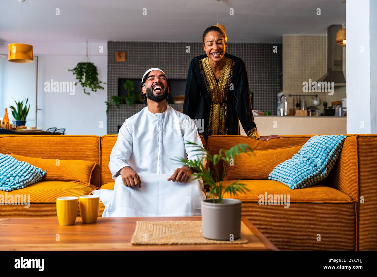 Happy beautiful young arab couple with emirati clothing together at ...