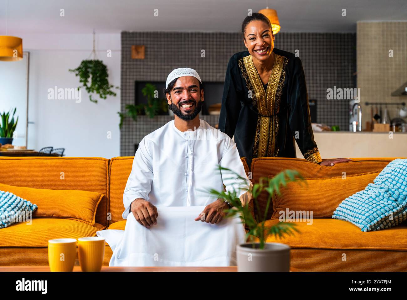 Happy beautiful young arab couple with emirati clothing together at ...