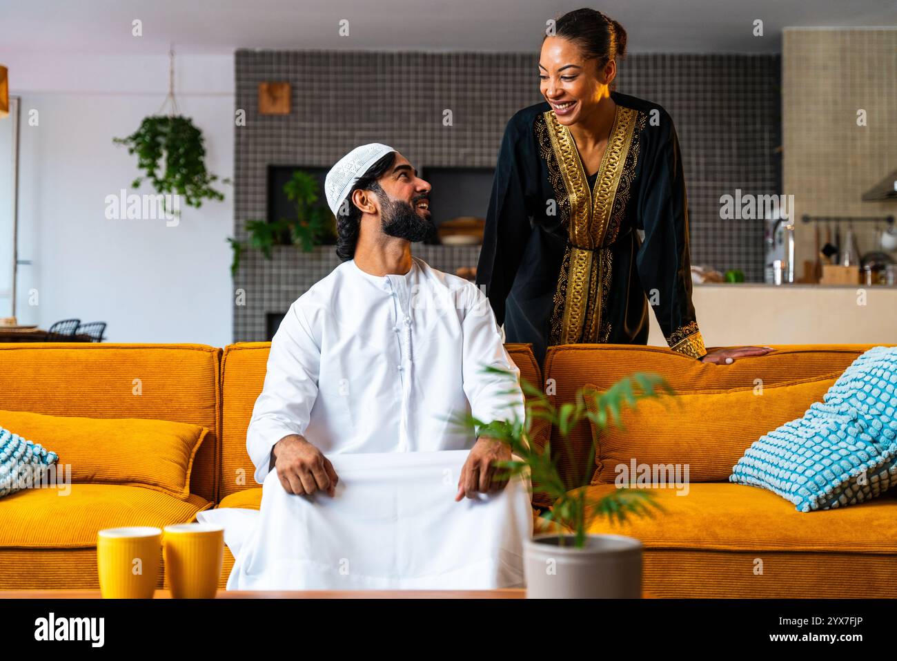 Happy beautiful young arab couple with emirati clothing together at ...