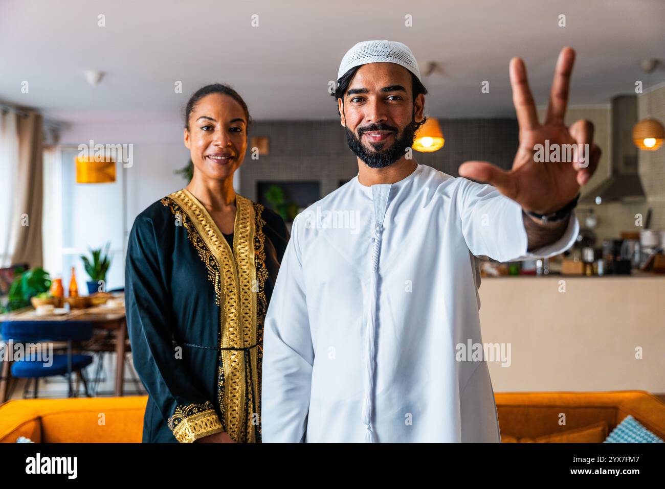 Happy beautiful young arab couple with emirati clothing together at ...