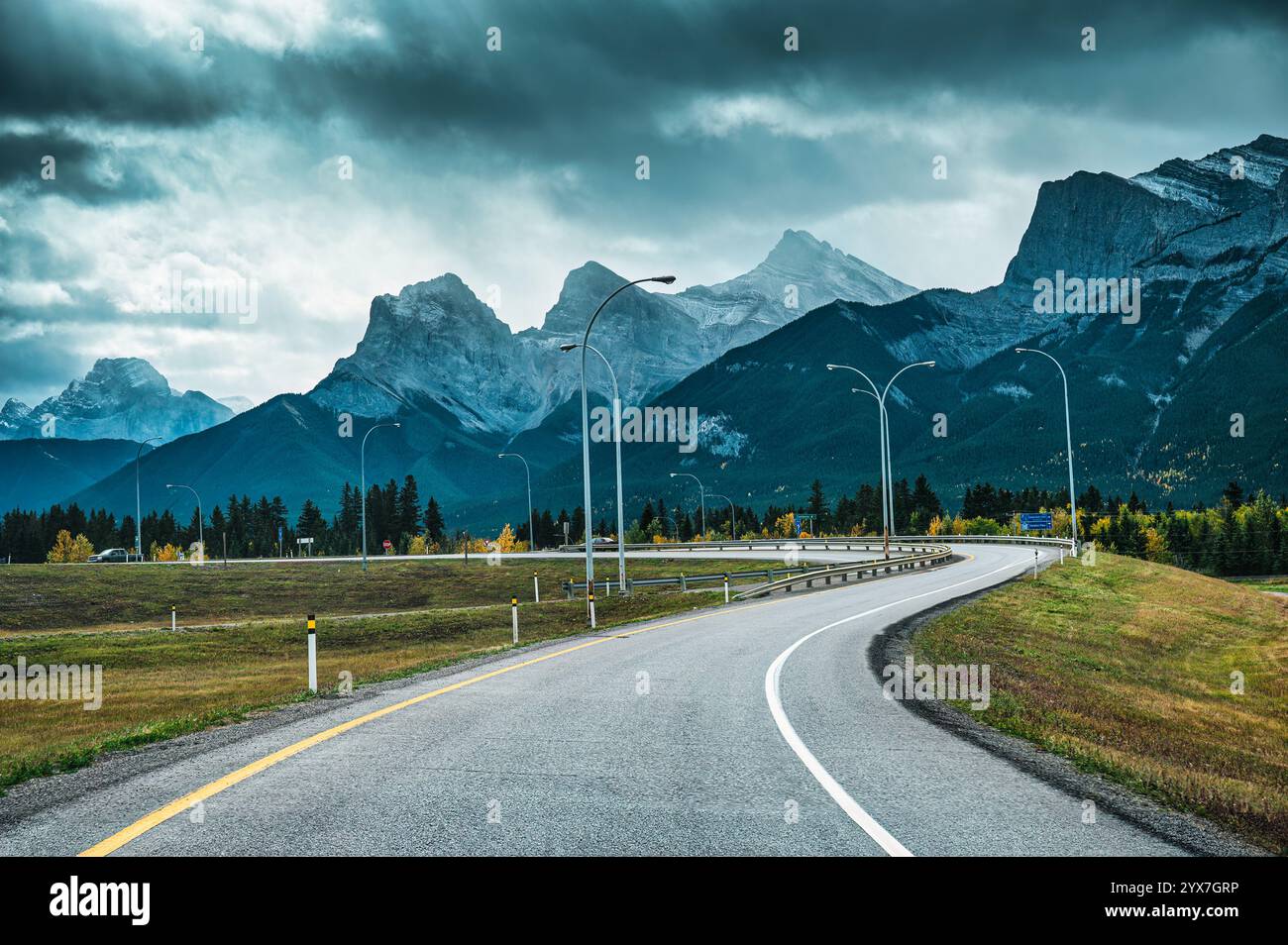 Scenic road trip with Three sisters mountains over winding road in ...