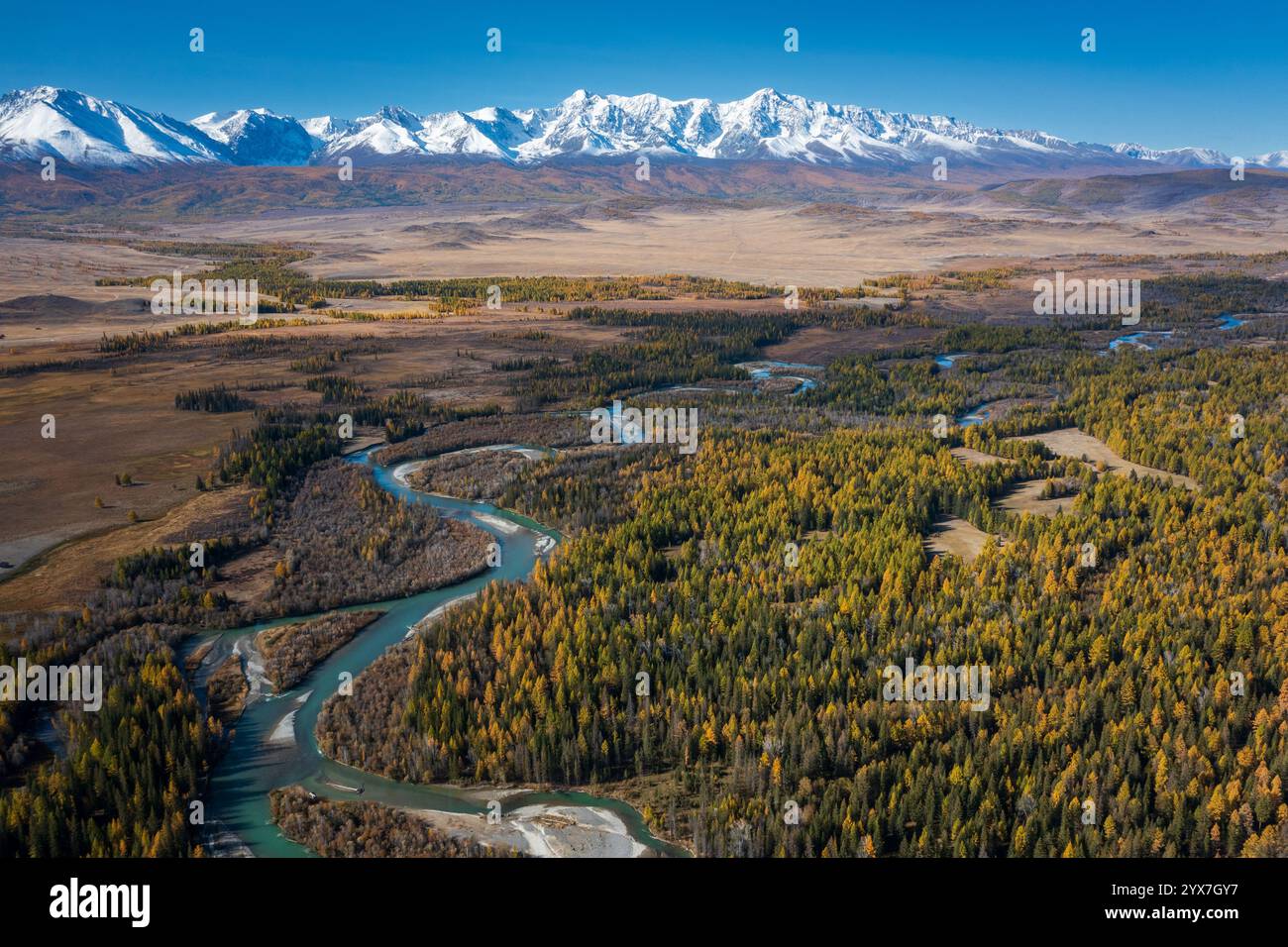 Aerial view of mountain valley during autumn with vibrant colors ...