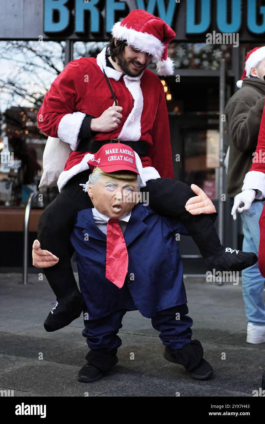 People dressed as Santa take part in the London Santacon Christmas ...