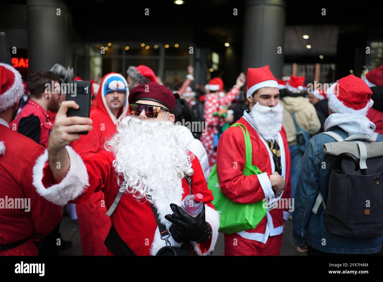 People dressed as Santa take part in the London Santacon Christmas ...