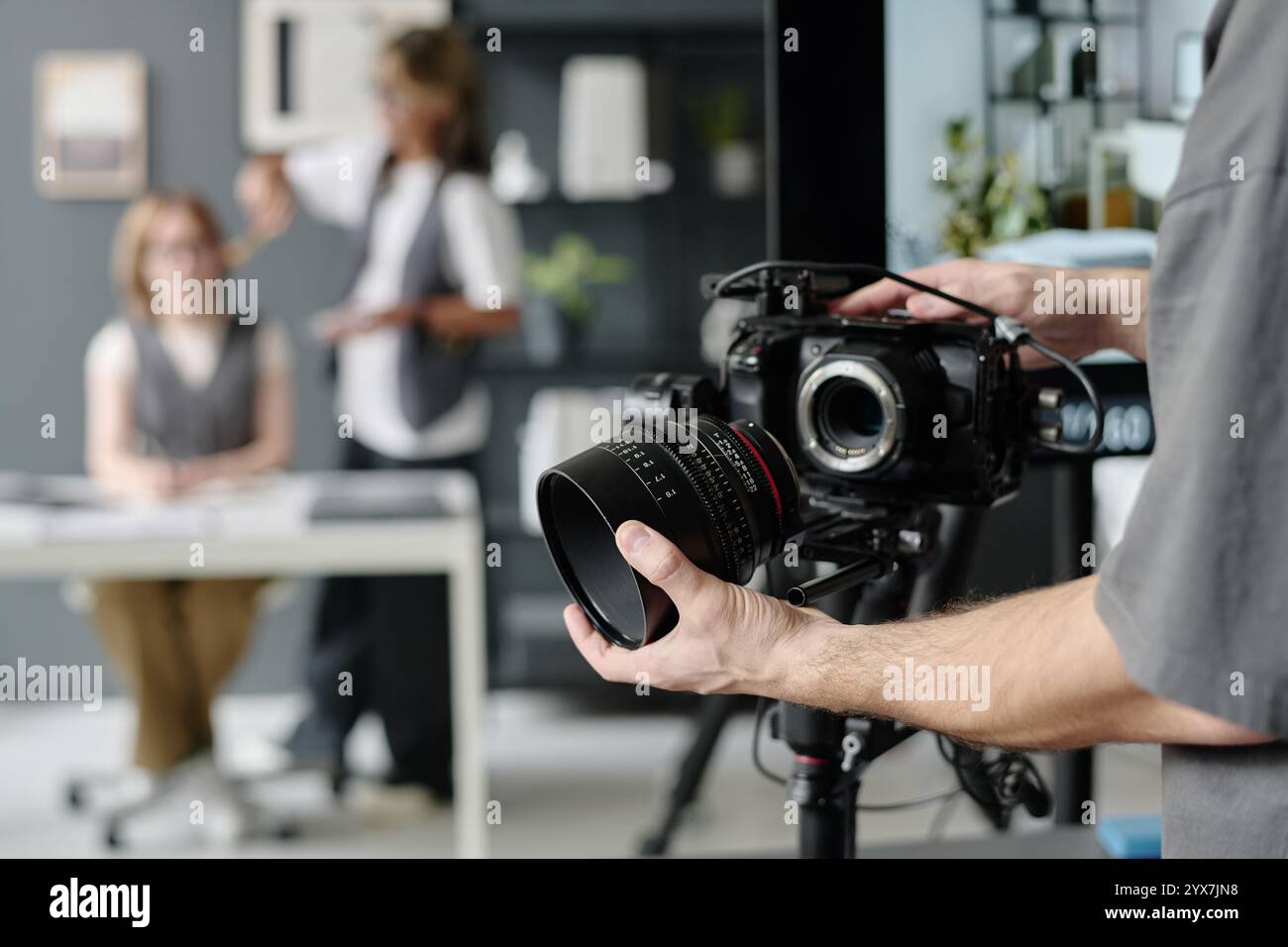 Medium close up of unrecognizable operators hands holding massive ...