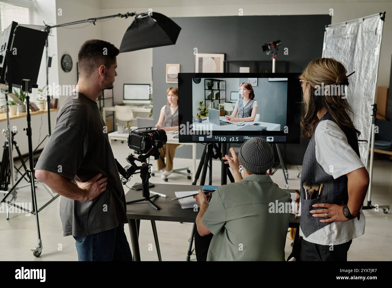 Back view footage man sitting hi-res stock photography and images - Alamy
