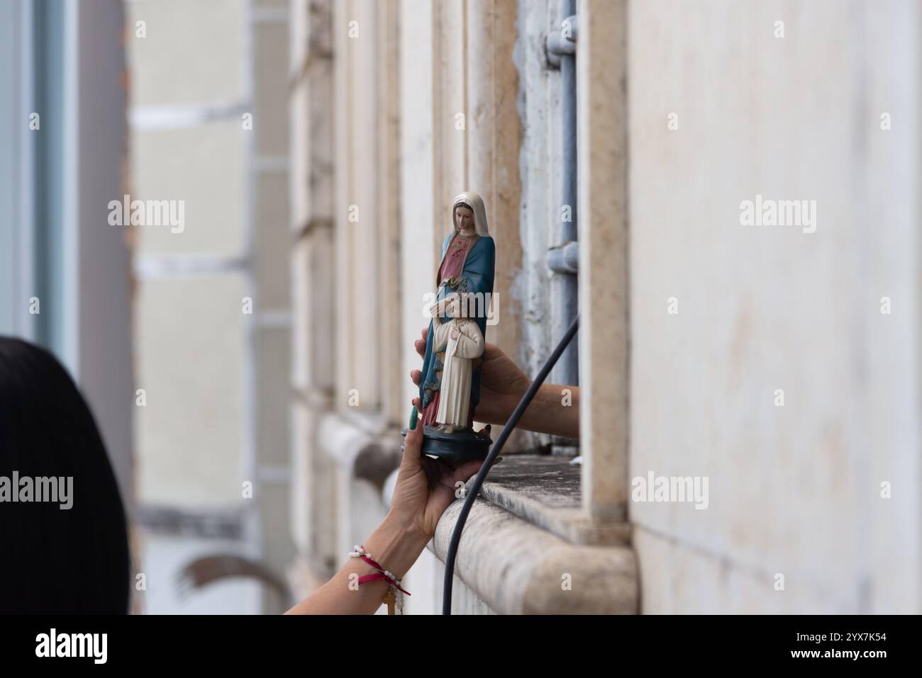 Salvador, Bahia, Brazil - December 08, 2024: Catholics are seen holding ...