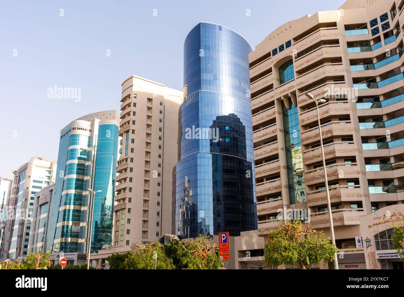 A view of modern high-rise buildings with glass facades lining a city ...