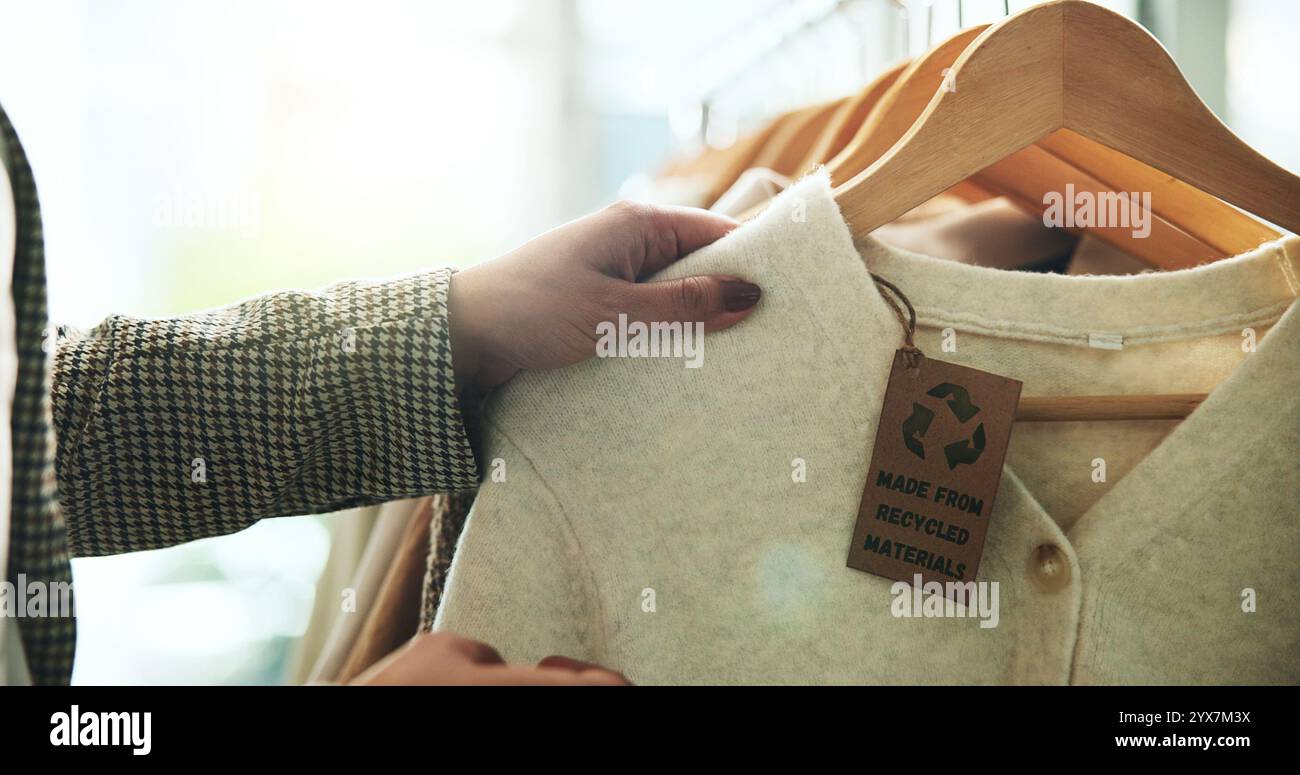 Shopping, store and hands with clothes on rack for recycling ...