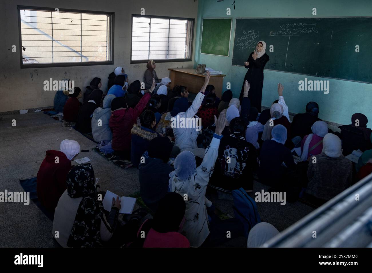 Gaza, Gaza, Palestine. 13th Dec, 2024. Palestinian girls sit on the ...