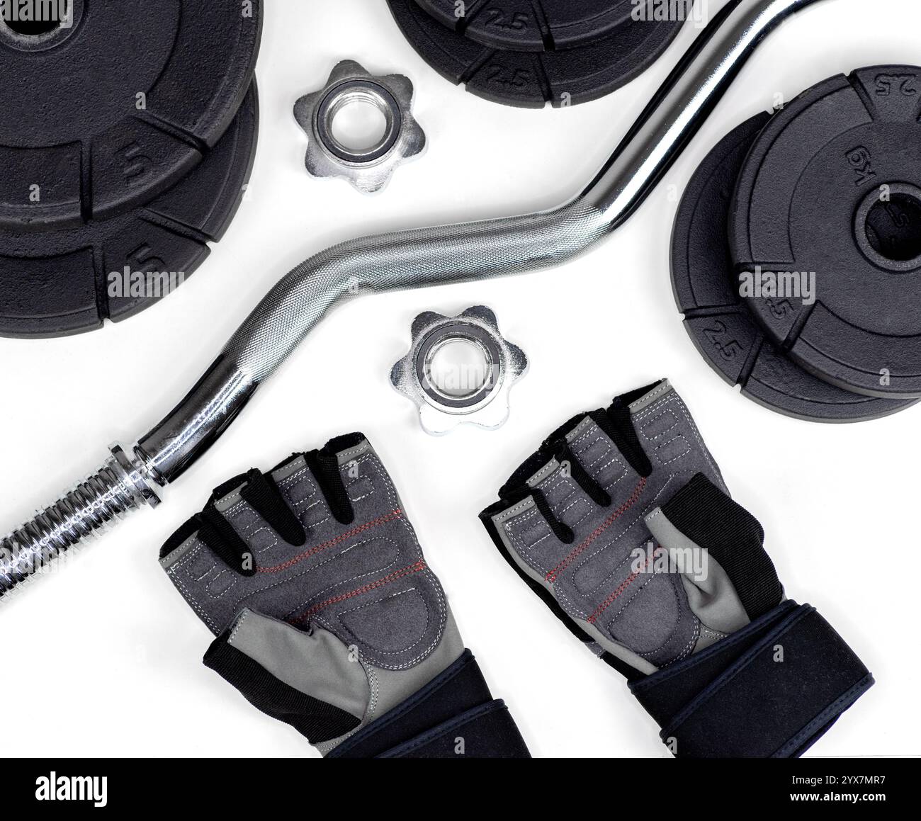 Metal barbell EZ bar, weights and gloves on white background Stock ...
