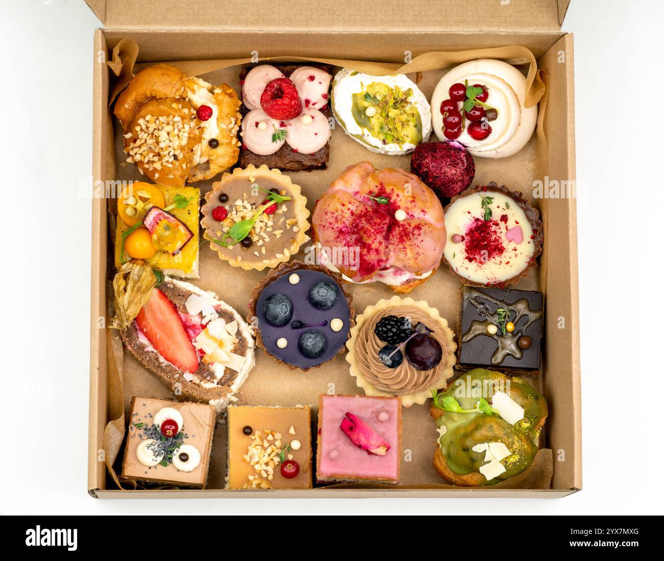Handmade cdelicious cakes in a box on white background Stock Photo - Alamy