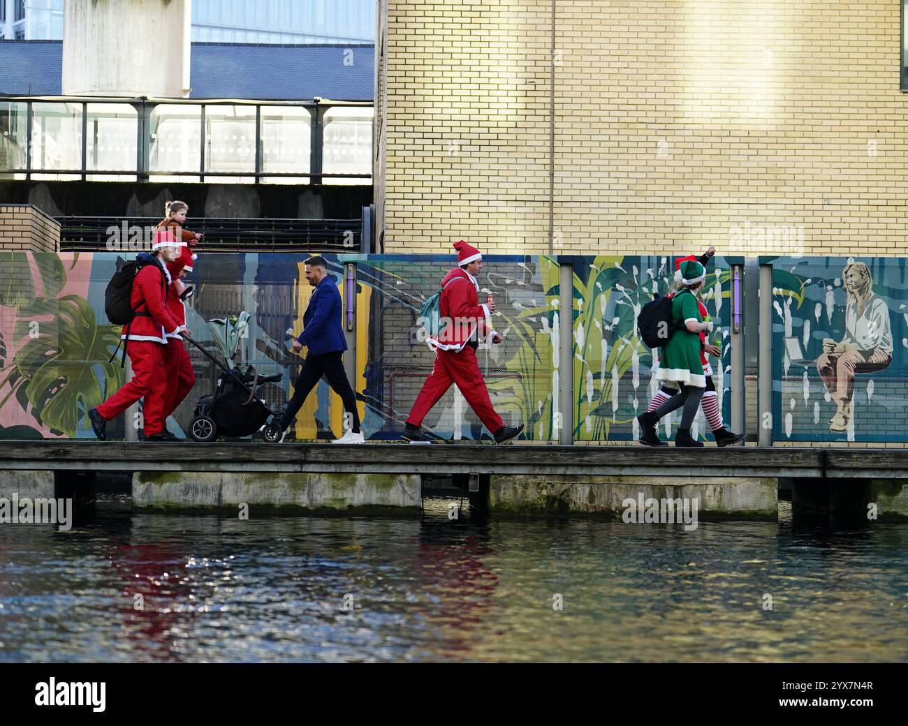 People dressed as Santa take part in the London Santacon Christmas ...