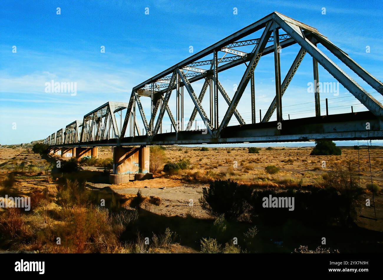Film image Railroad bridge Dry Gila river bed Sonora desert in central ...