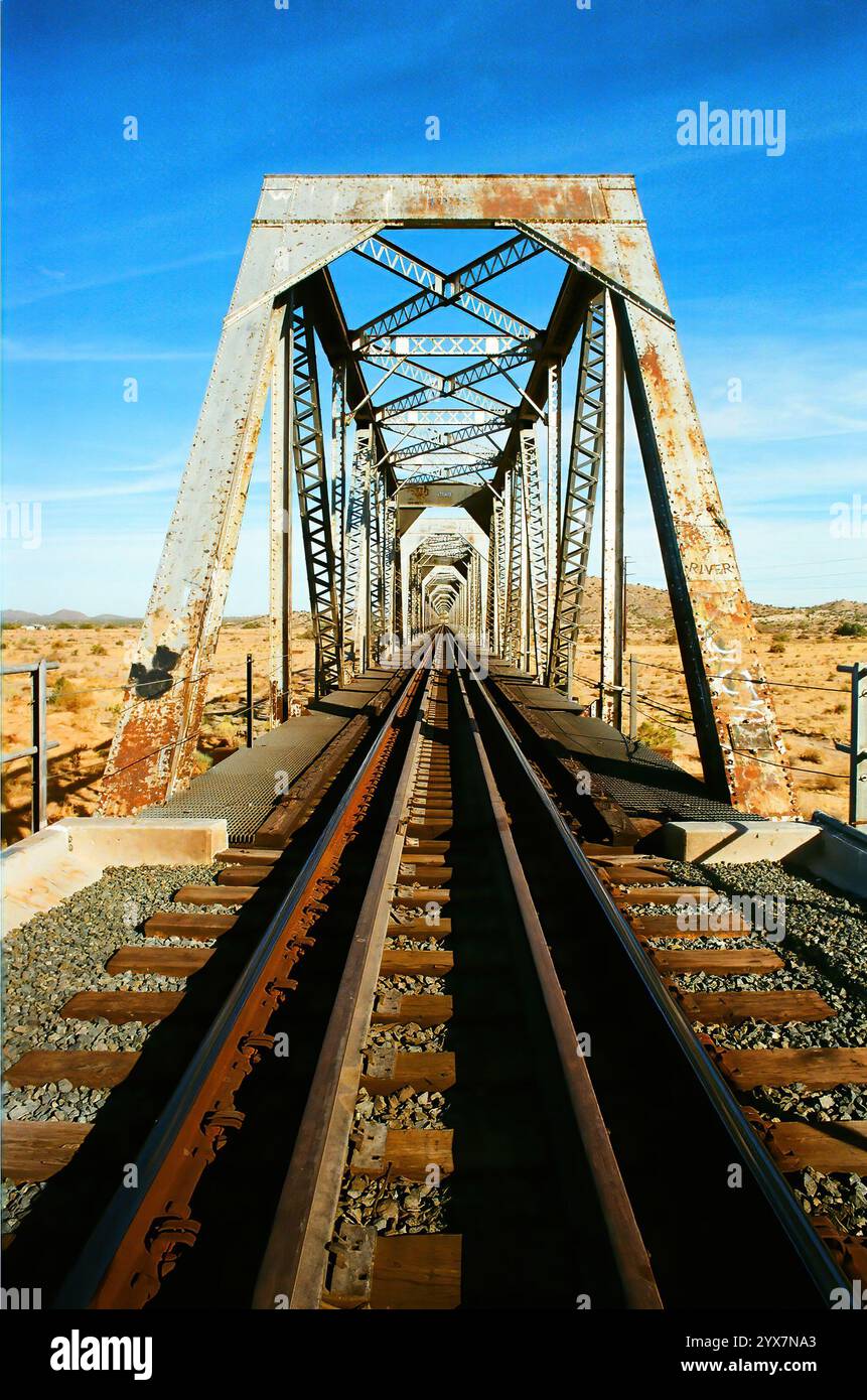 Film image Railroad bridge Dry Gila river bed Sonora desert in central ...