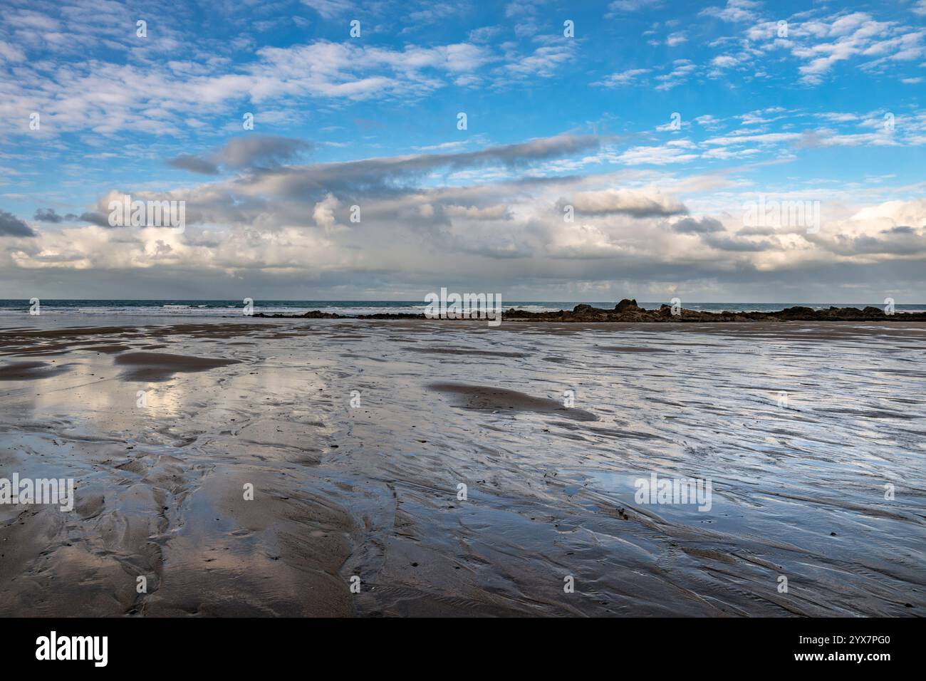 December blue sky with dappled clouds on Widemouth Bay beach Cornwall ...