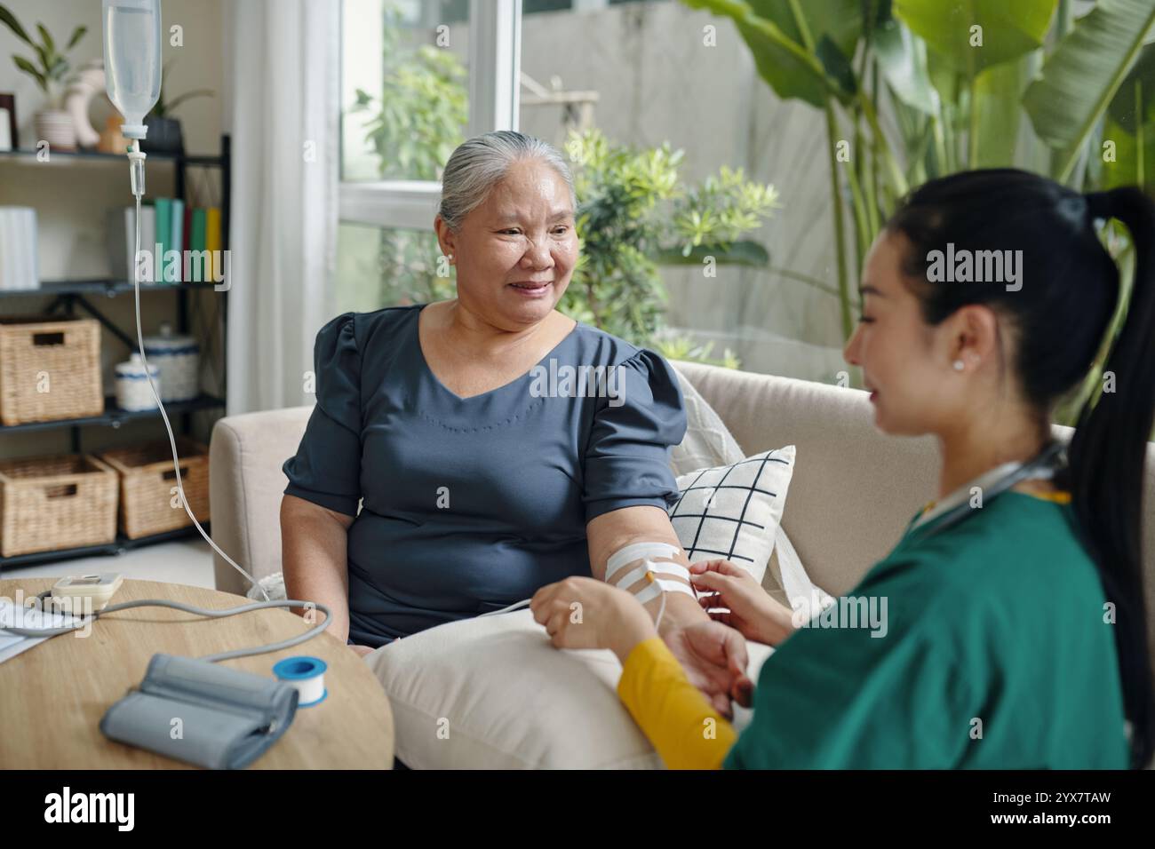 Nurse Putting IV Drip On Her Patient Stock Photo - Alamy