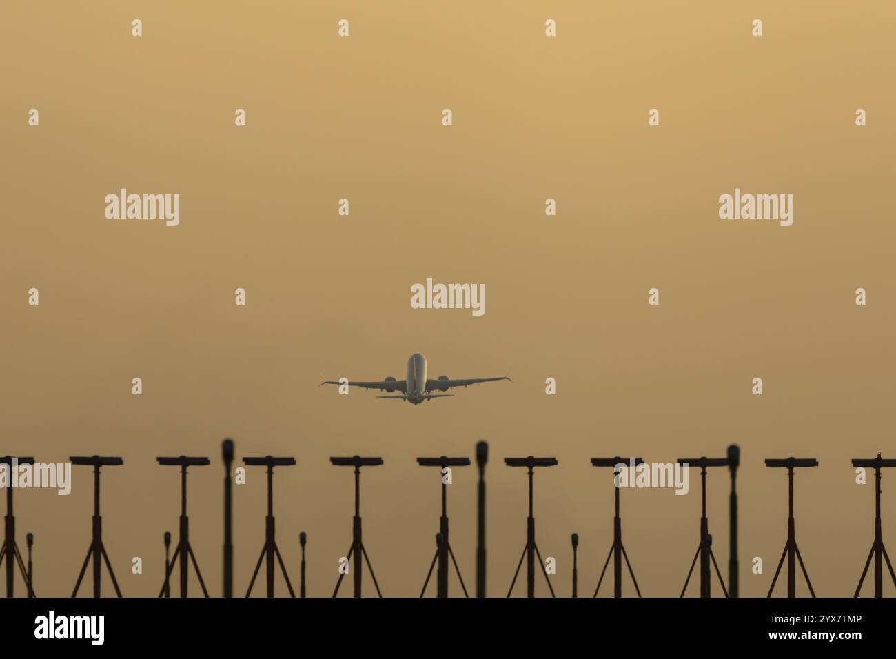 Boeing 737 jet passenger aircraft taking off at sunset, London Stansted ...