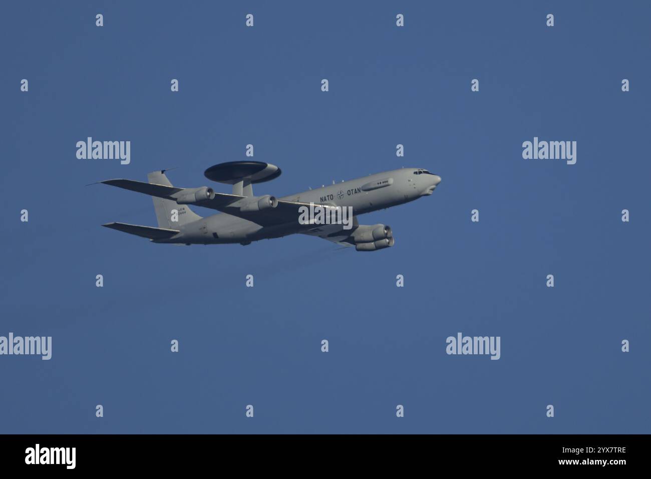 Boeing E-3 Sentry AWACS military aircraft of NATO flying in a blue sky ...