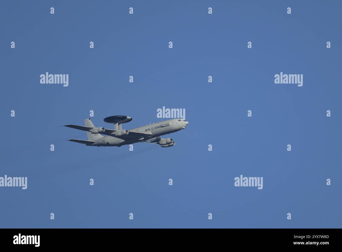 Boeing E-3 Sentry AWACS military aircraft of NATO flying in a blue sky ...