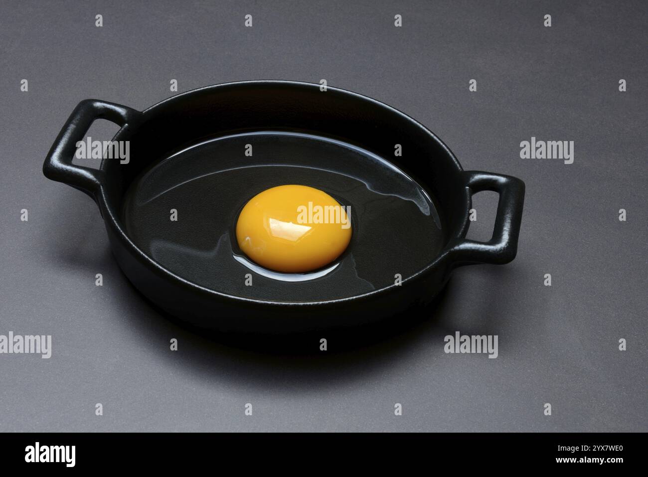 Cracked egg in a pan, hen's egg Stock Photo - Alamy