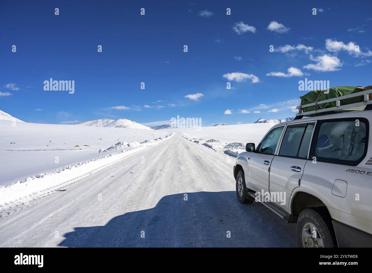 Off-road vehicle on the wintry Pamir Highway, Gorno-Badakhshan Province ...
