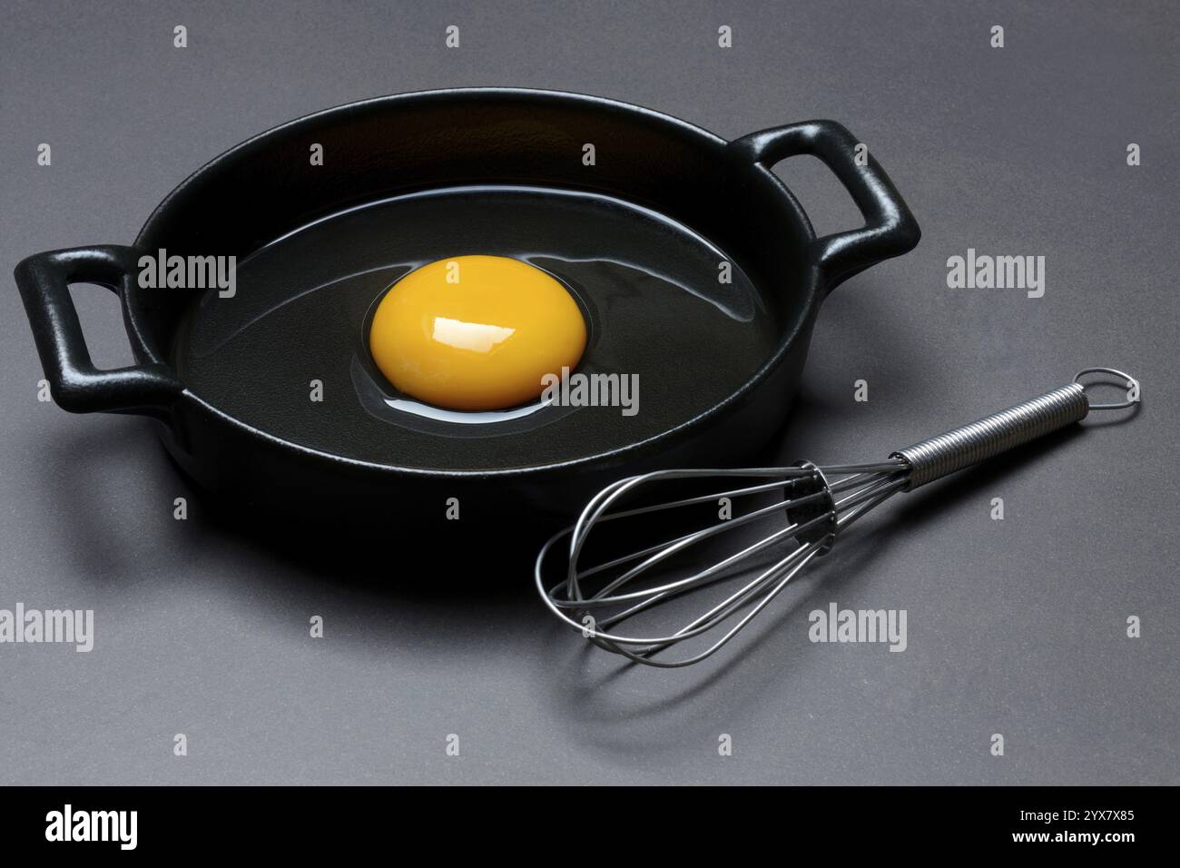 Cracked egg in a pan, hen's egg Stock Photo - Alamy