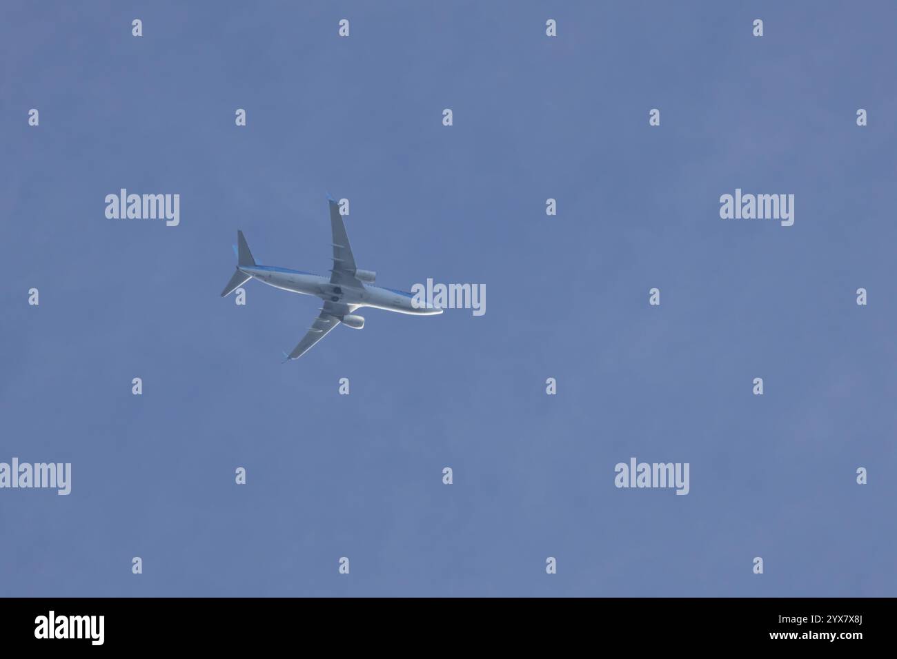 Boeing 737 jet passenger aircraft of TUI holidays flying in a blue sky ...