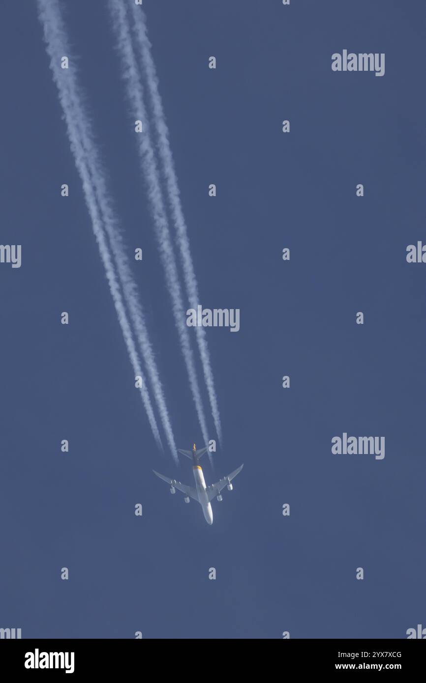 Boeing 747 jumbo jet cargo aircraft of UPS flying in a blue sky with a ...