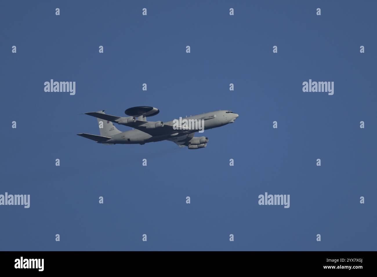 Boeing E-3 Sentry AWACS military aircraft of NATO flying in a blue sky ...