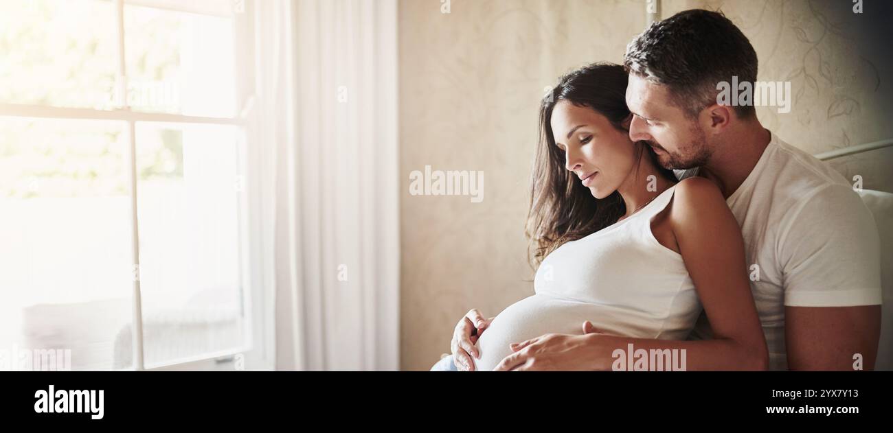 Relax, pregnancy and couple by window in home with love, bonding and marriage commitment to ...