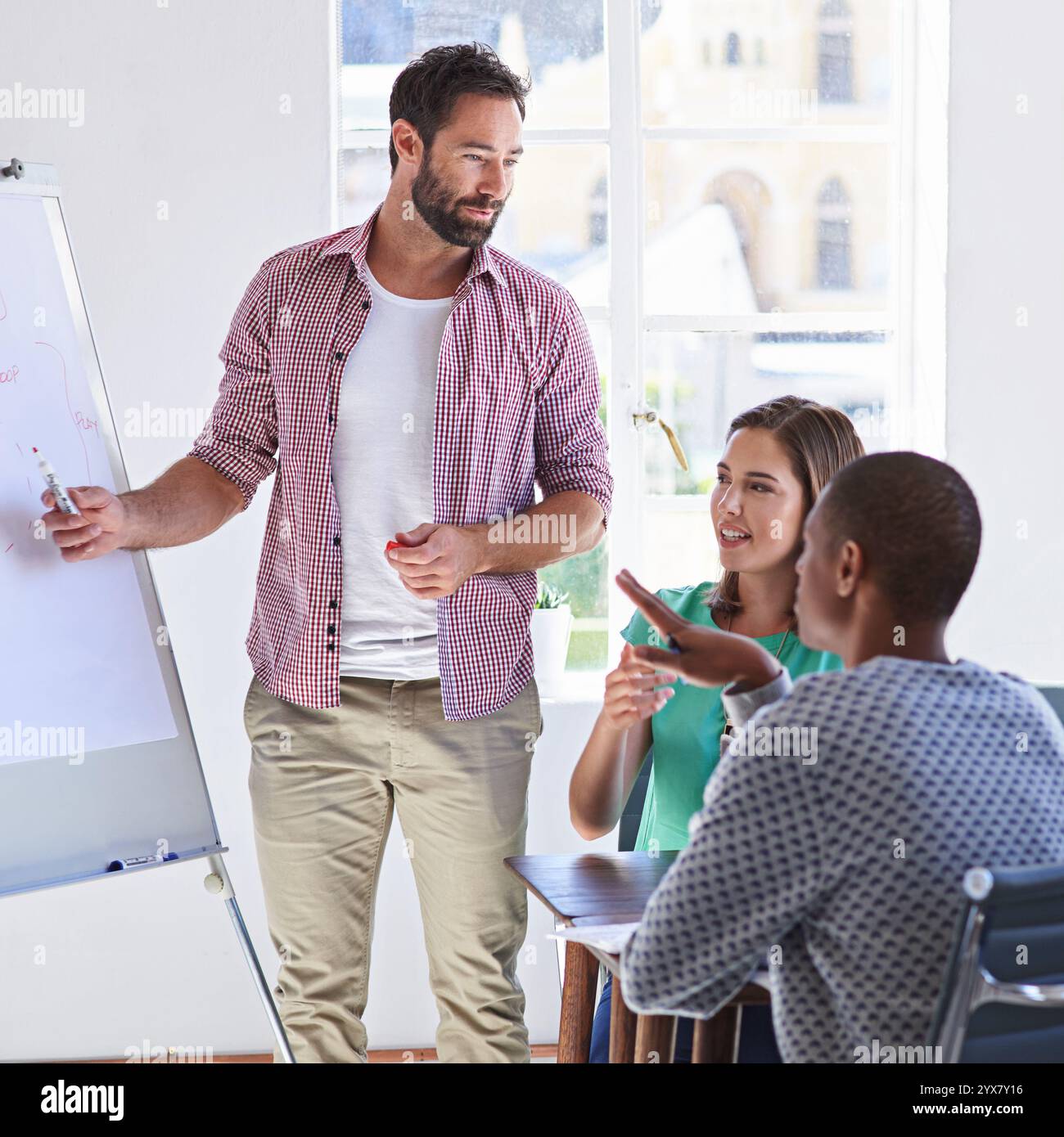Man, whiteboard and speaker in office at startup for planning ...