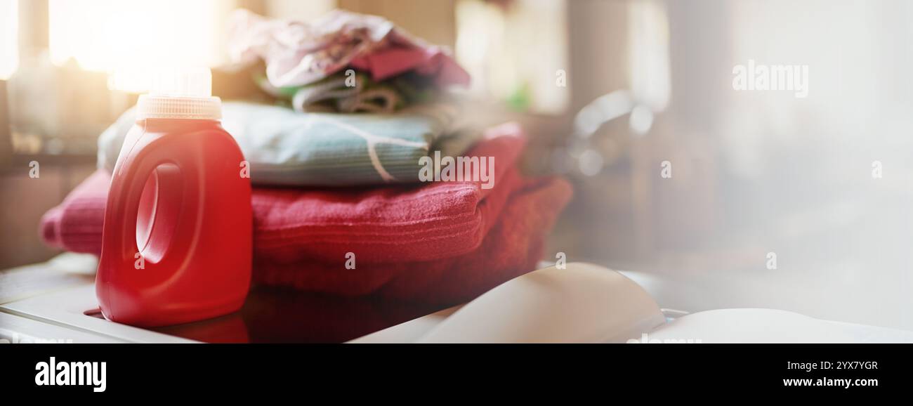 Laundry, detergent bottle and clean clothes at house for fresh smell ...