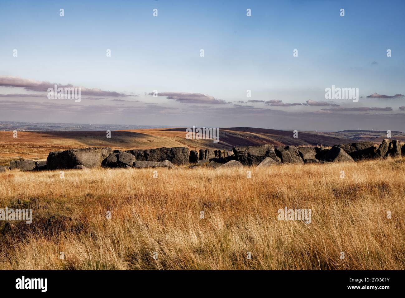 Gritstone boulders litter the upland pasture at Blackstone Edge ...
