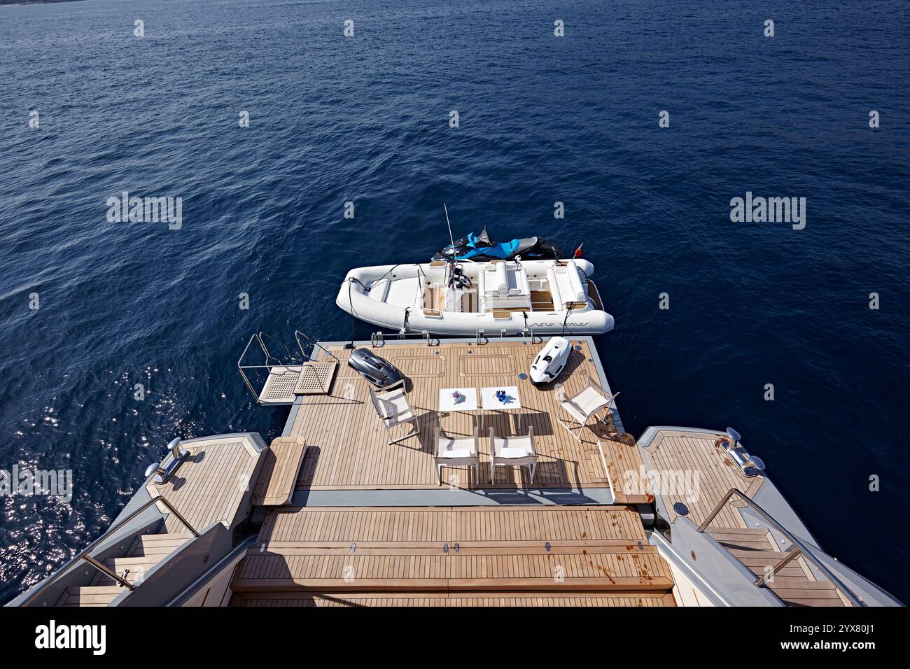 Luxury Yacht Swimming Deck Overlooking a Calm Sea with a Docked ...