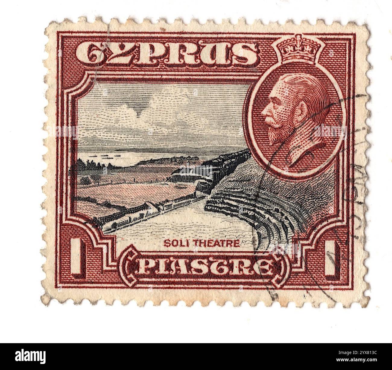 A vintage King George V postage stamp from Cyprus isolated on a white ...